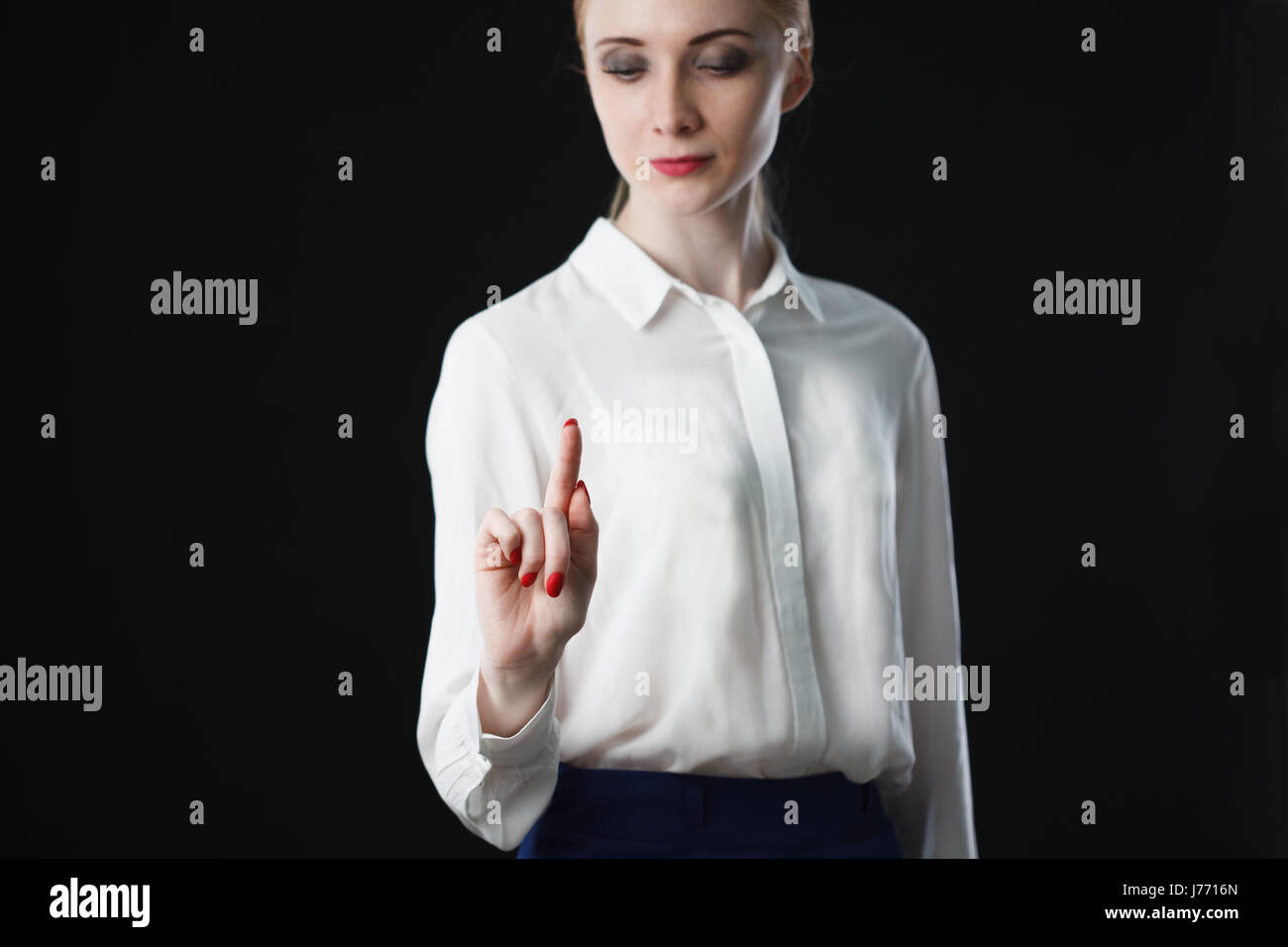 Business woman pointing at something on screen Stock Photo - Alamy