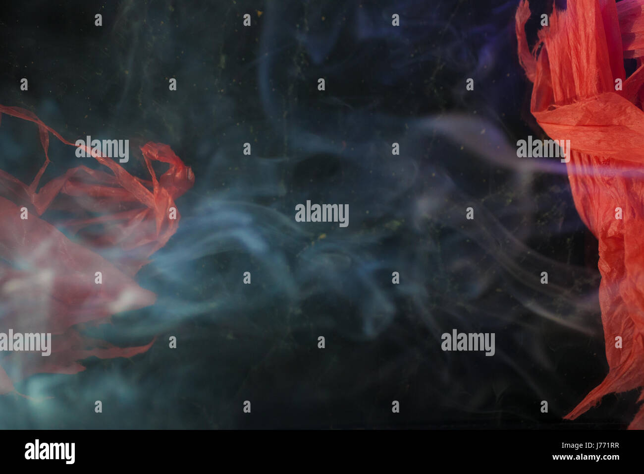 Abstract background with smoke and red cloth Stock Photo - Alamy