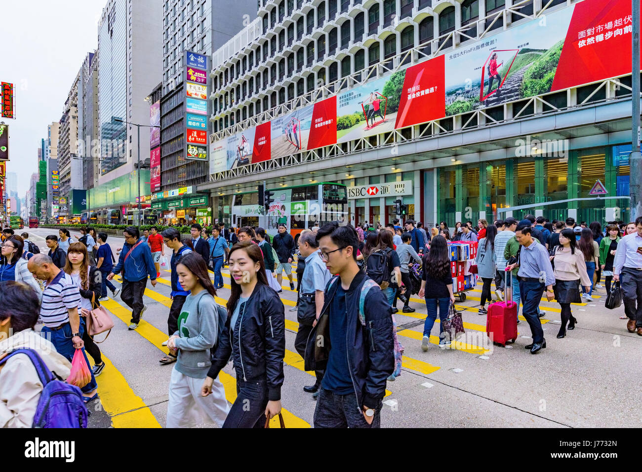 HONG KONG, CHINA - APRIL 24: This is a crowded street crossing in the ...