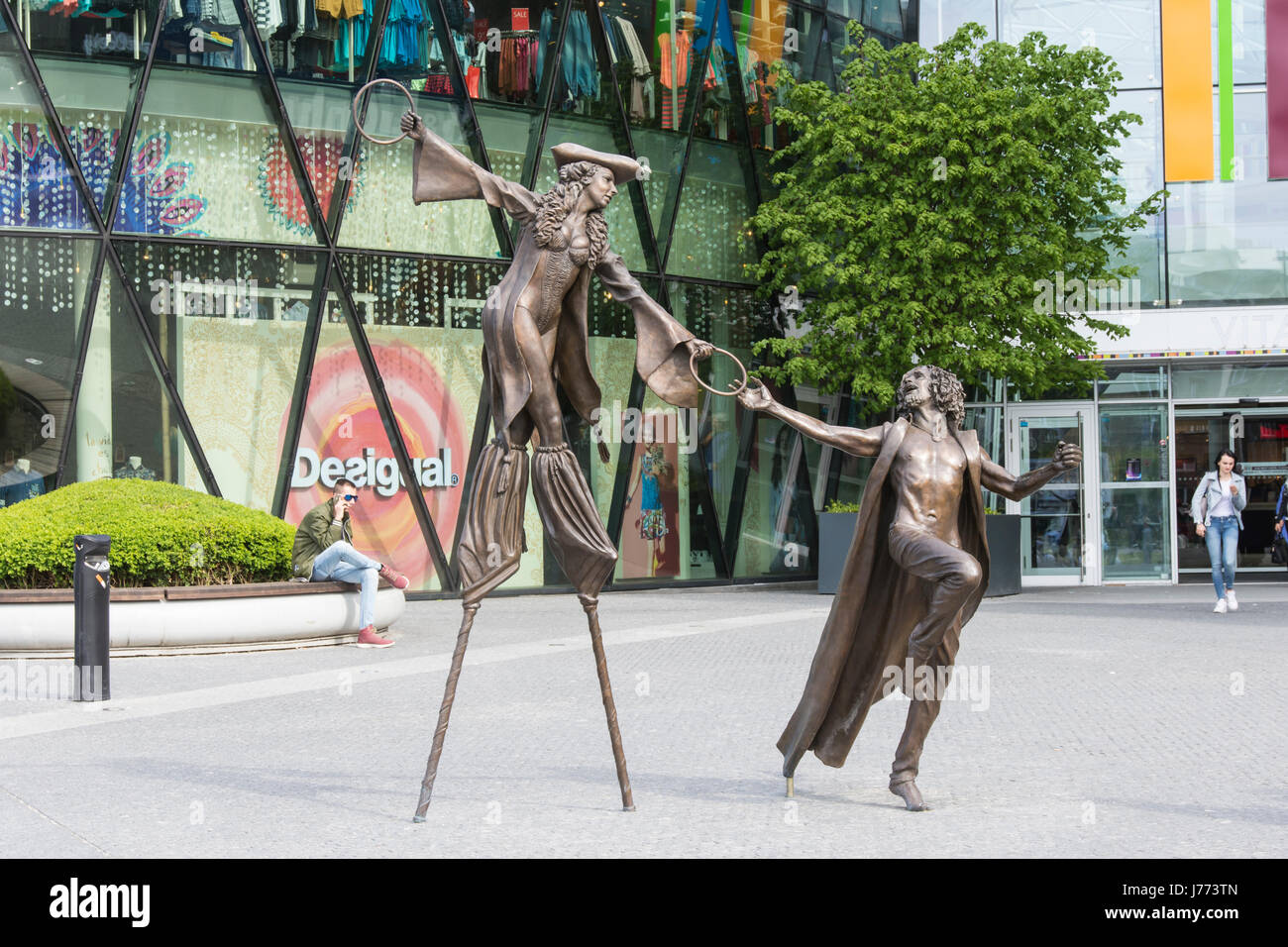 A statue in front a modern shopping mall in Bratislava Stock Photo - Alamy