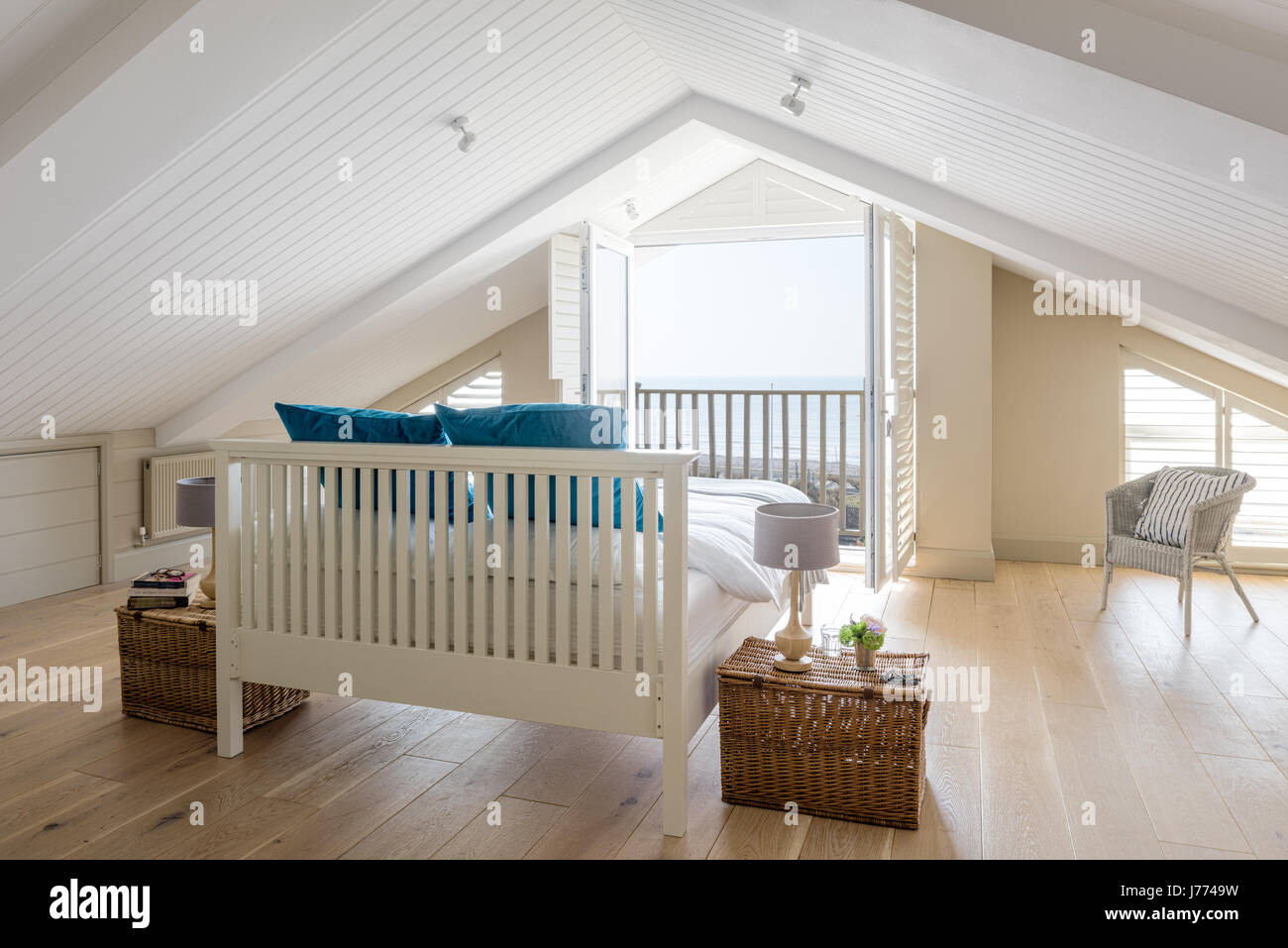 Feather & Black bed in top floor master bedroom with pitched ceiling ...