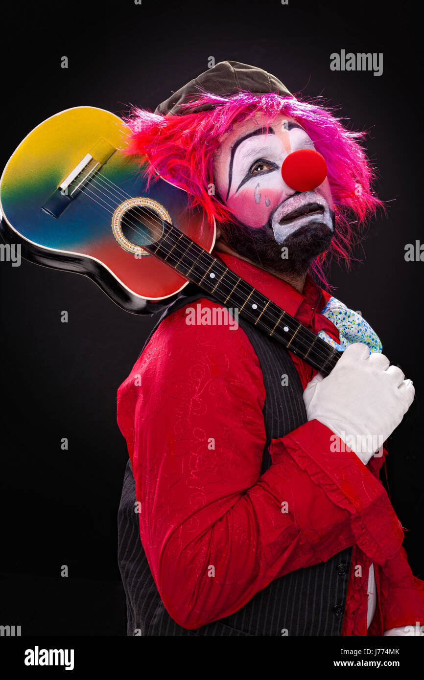 The clown with guitar hi-res stock photography and images - Alamy