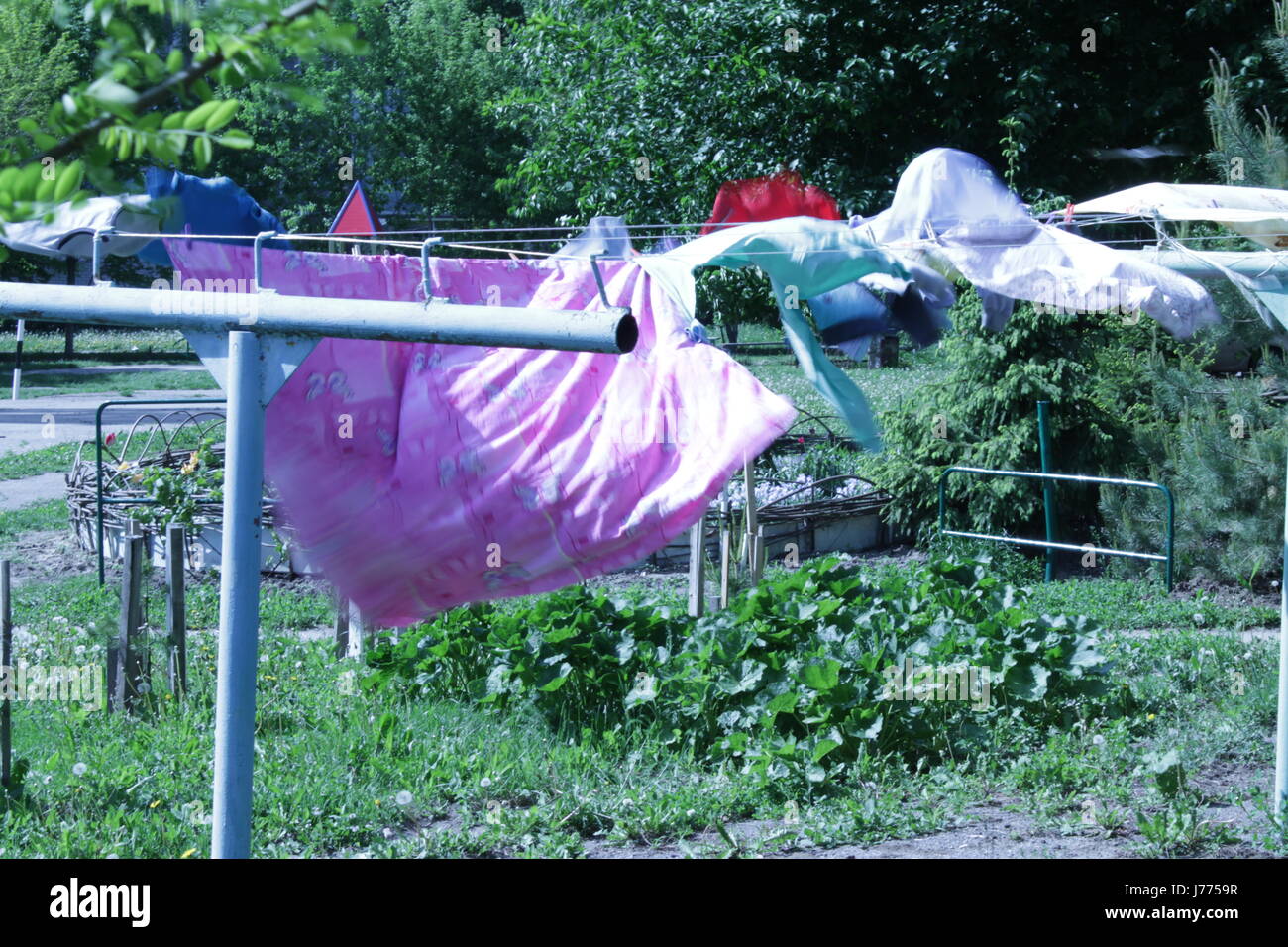 The clothes hang on the rope and dry Stock Photo - Alamy