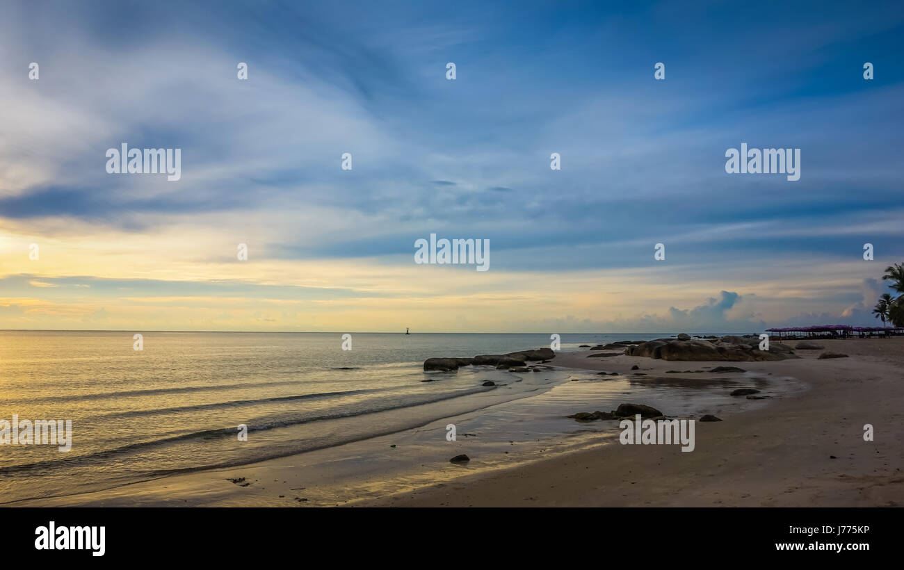 Sunlight shimmering water surface on tropical beach Stock Photo - Alamy