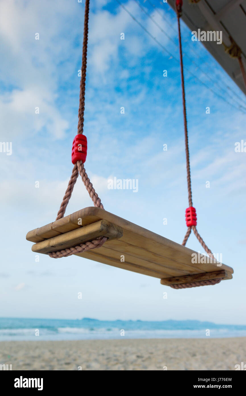Swing on sandy beach blue hi-res stock photography and images - Alamy