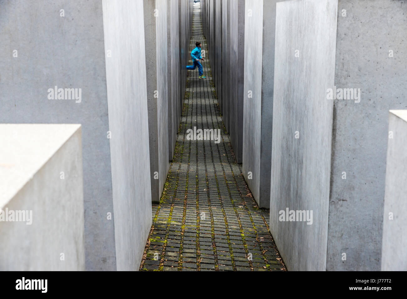 Berlin, Germany - April 12, 2017: Boy running in the Memorial to the ...