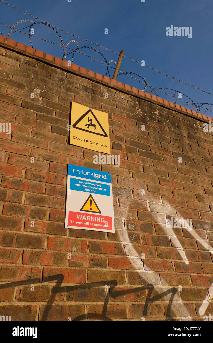 Warning sign at an electricity plant in Clapton,London,UK Stock Photo ...