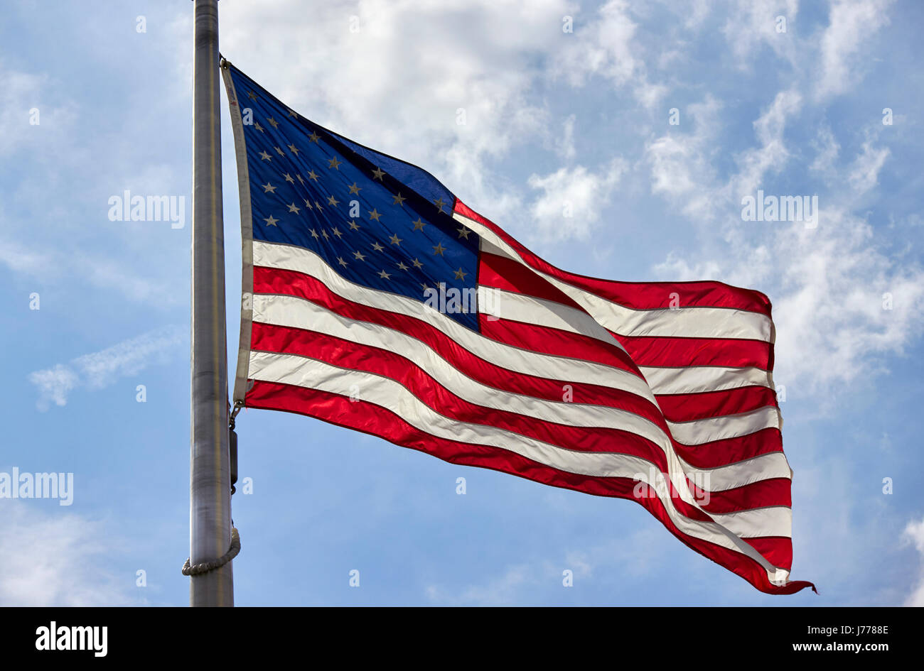 us flag flying against blue sky Washington DC USA Stock Photo - Alamy