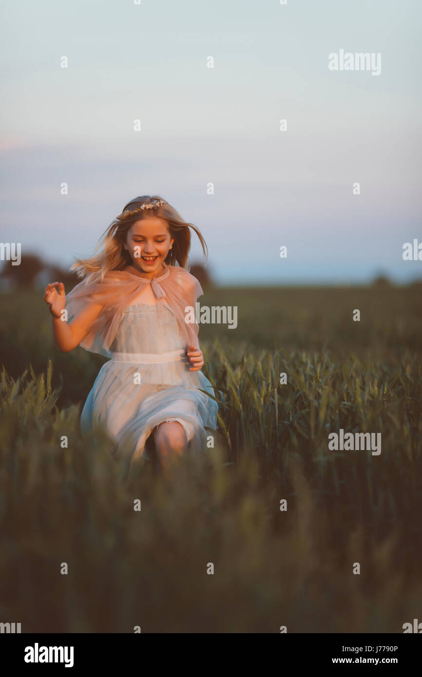 Girl running grassy field childhood hi-res stock photography and images ...