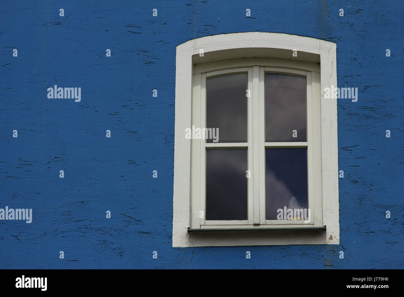 blue house building window porthole dormer window pane wall contrast ...