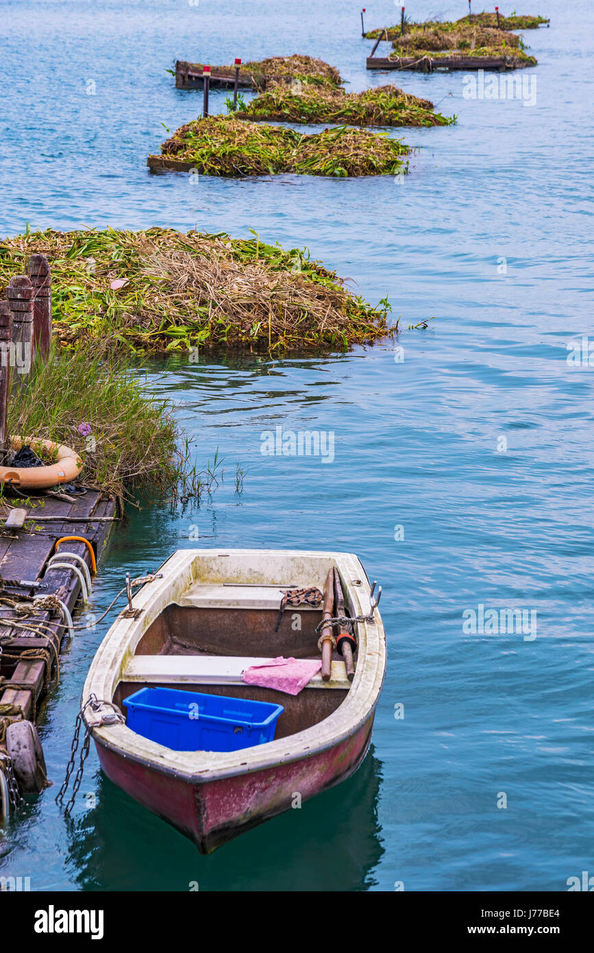 Boat in a lake with nature Stock Photo - Alamy