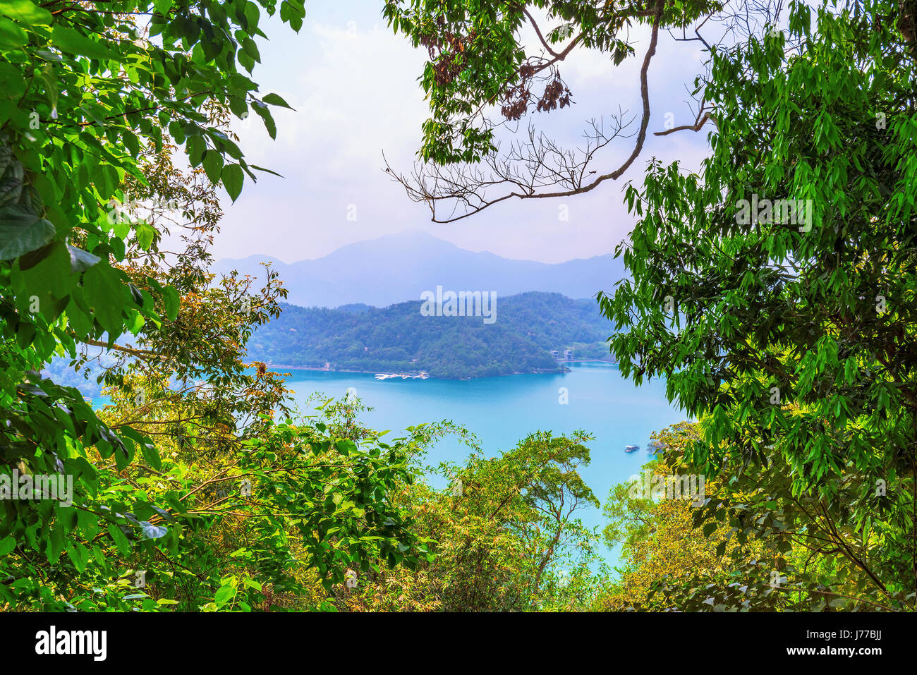 View of Sun Moon Lake through forest trees Stock Photo - Alamy