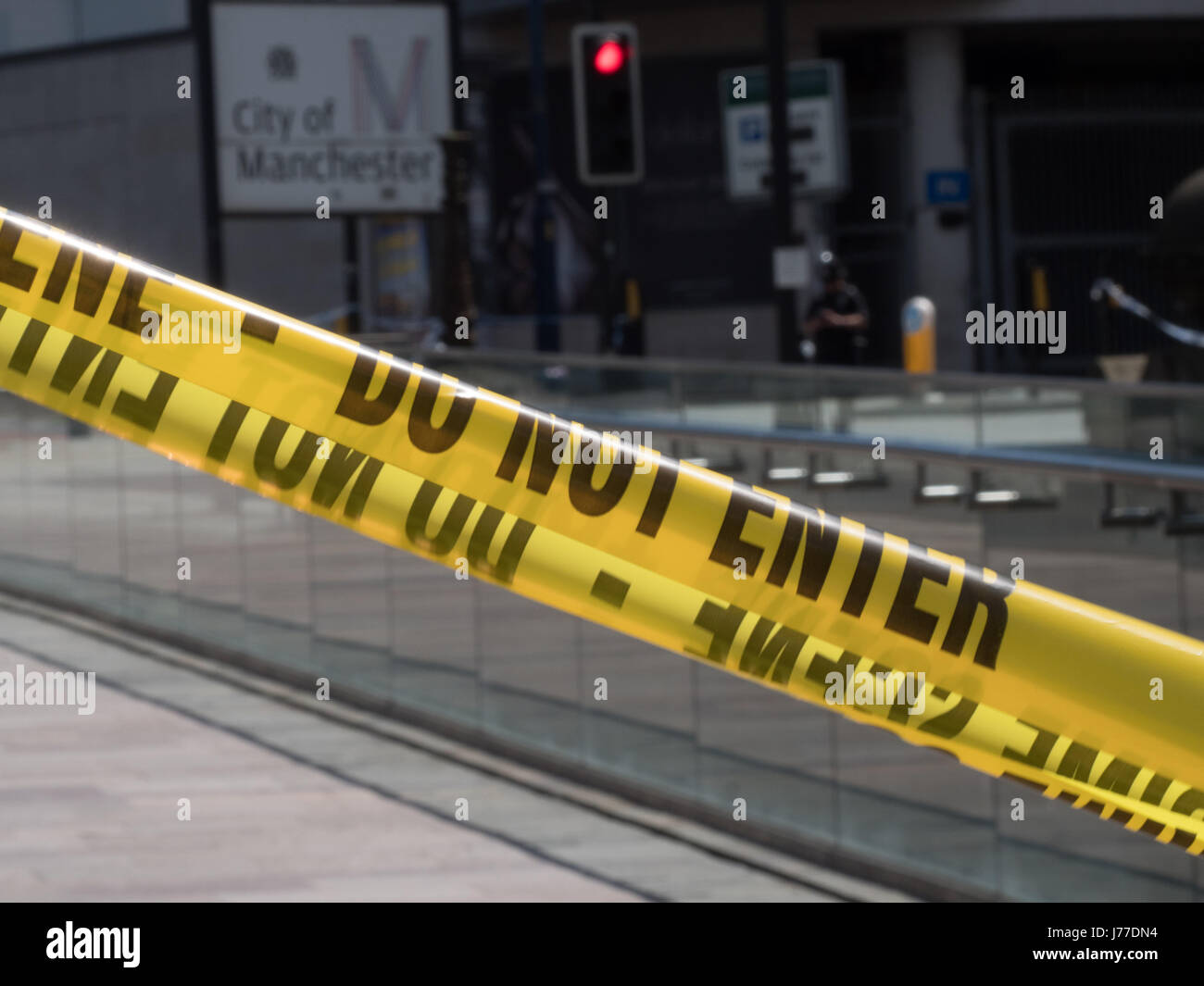 Manchester, UK. 23rd May, 2017. The police crime scene tape used as a ...