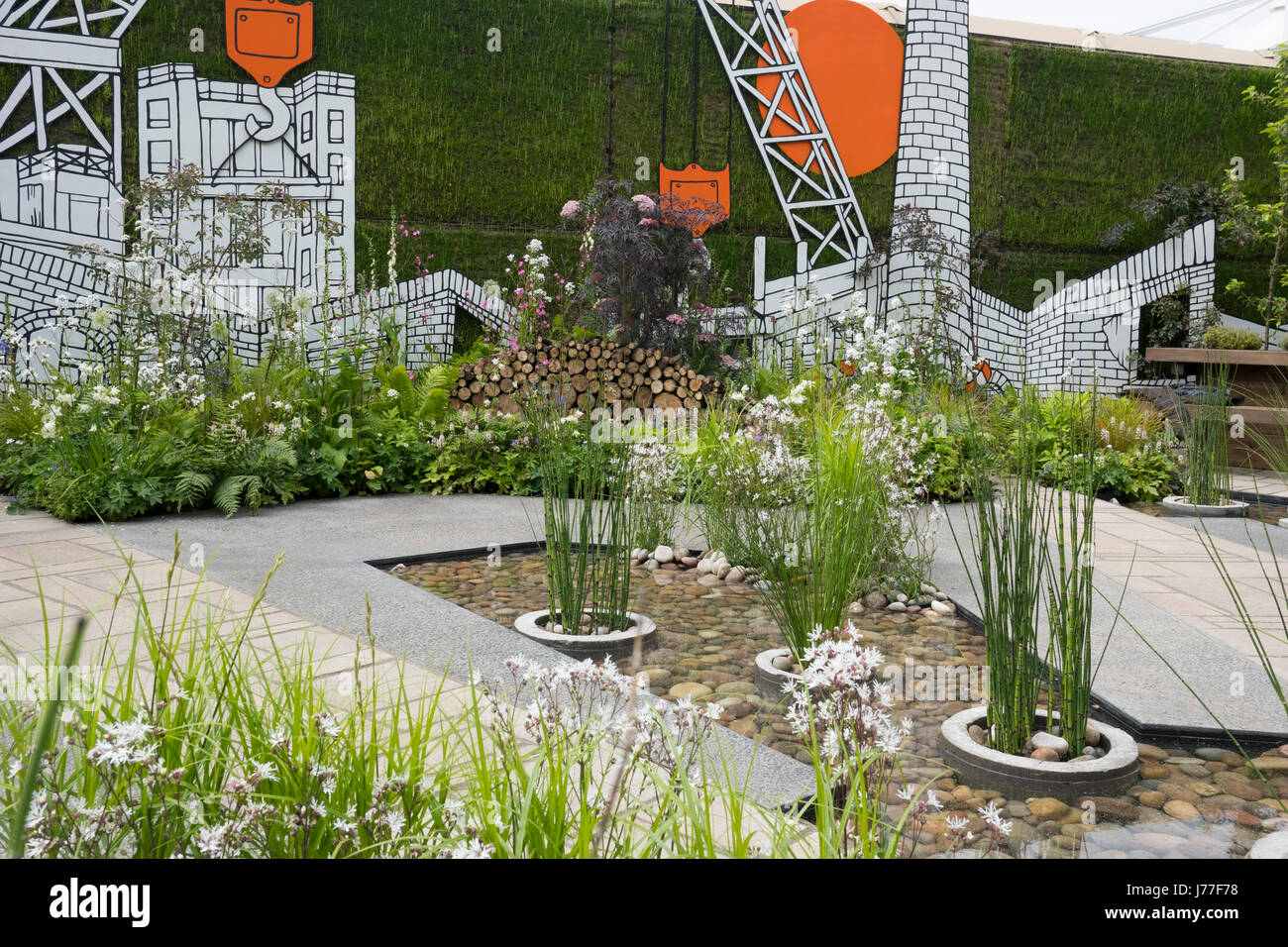 London, UK. 23rd May, 2017. A terrace with a water feature backed by a ...