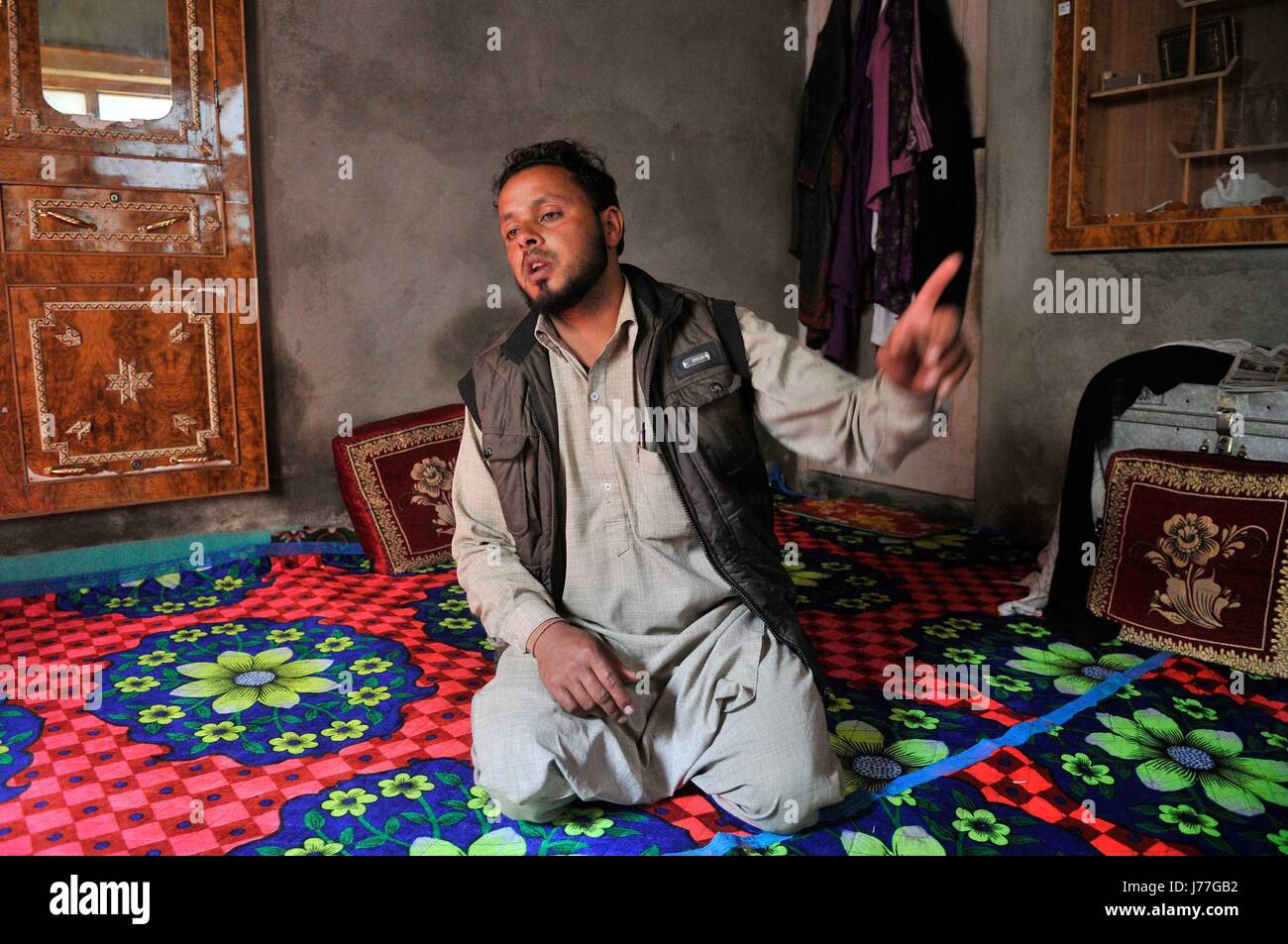 BUDGAM, INDIA - MAY 23: Embroidery artisan Farooq Ahmad Dar, who was ...