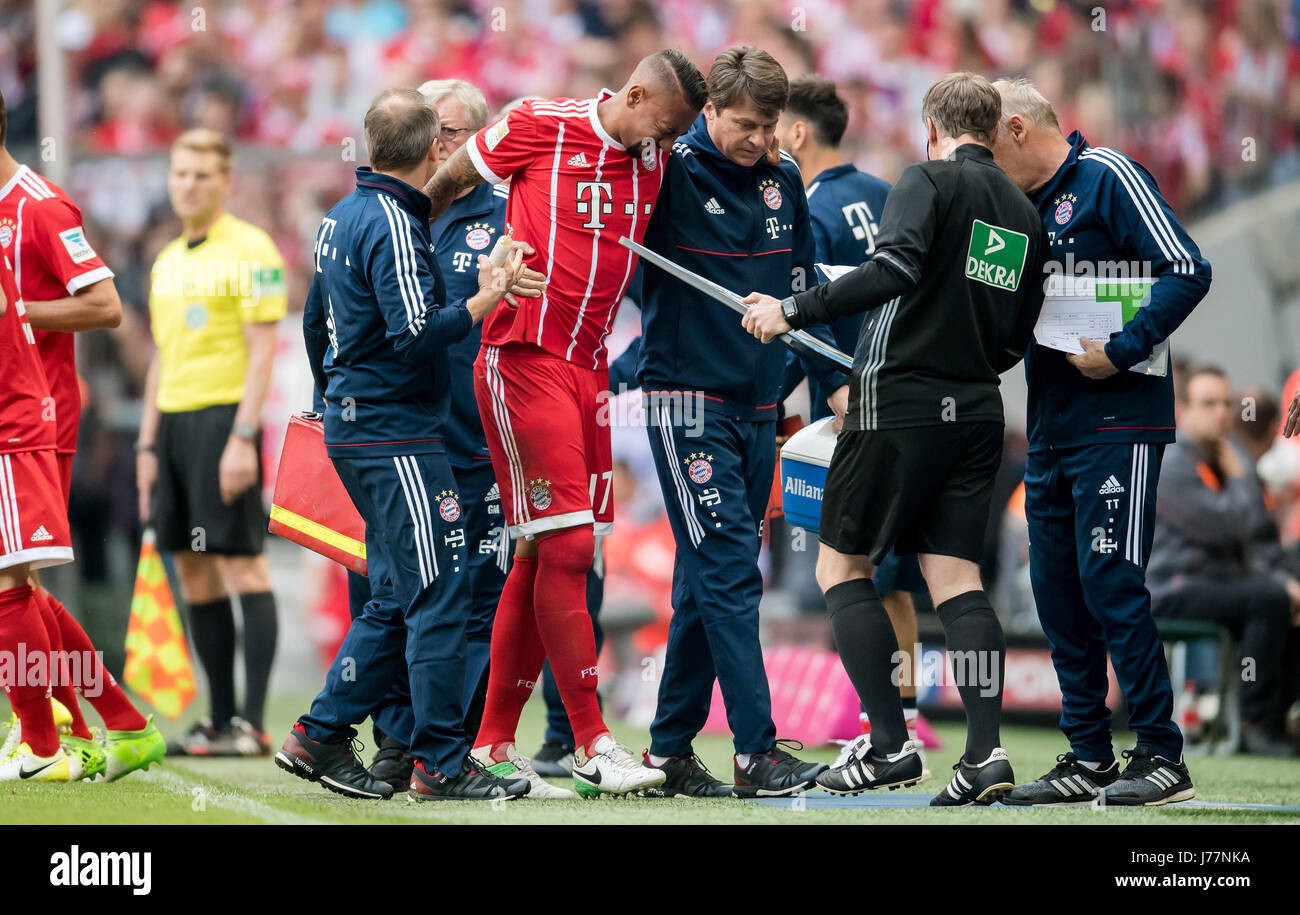 Munich's Jerome Boateng is helped off the pitch after suffering an ...