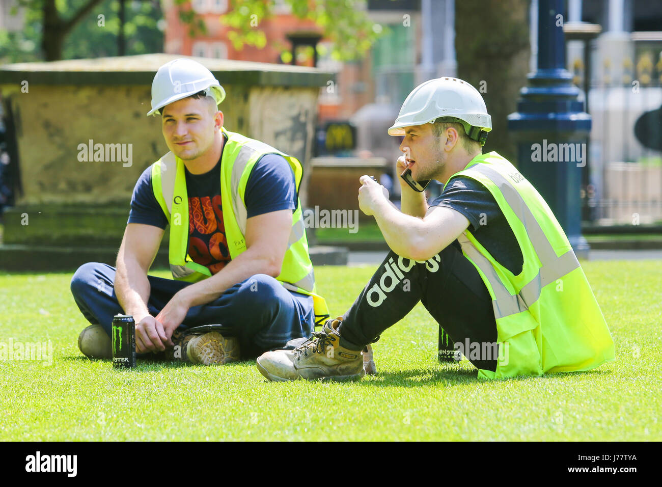 Construction workers taking a break in the park in summer weather Stock ...