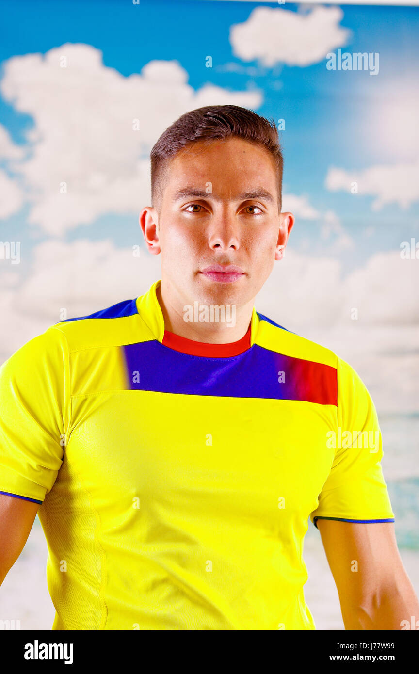 Young ecuadorian man wearing official Marathon football shirt standing ...