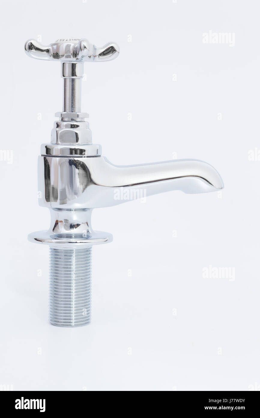 Single chrome water tap against a white background Stock Photo - Alamy