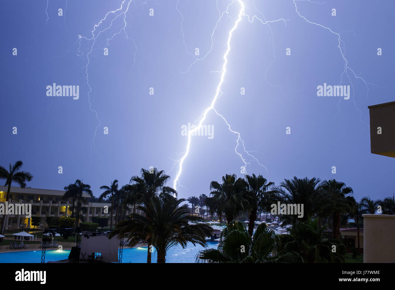 Tropical storm with lightning in hotel resort near sea Stock Photo - Alamy