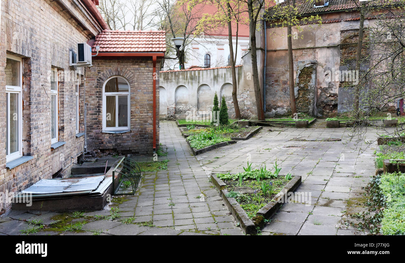 Spring April court yard of the old destroyed European church. Panoramic ...