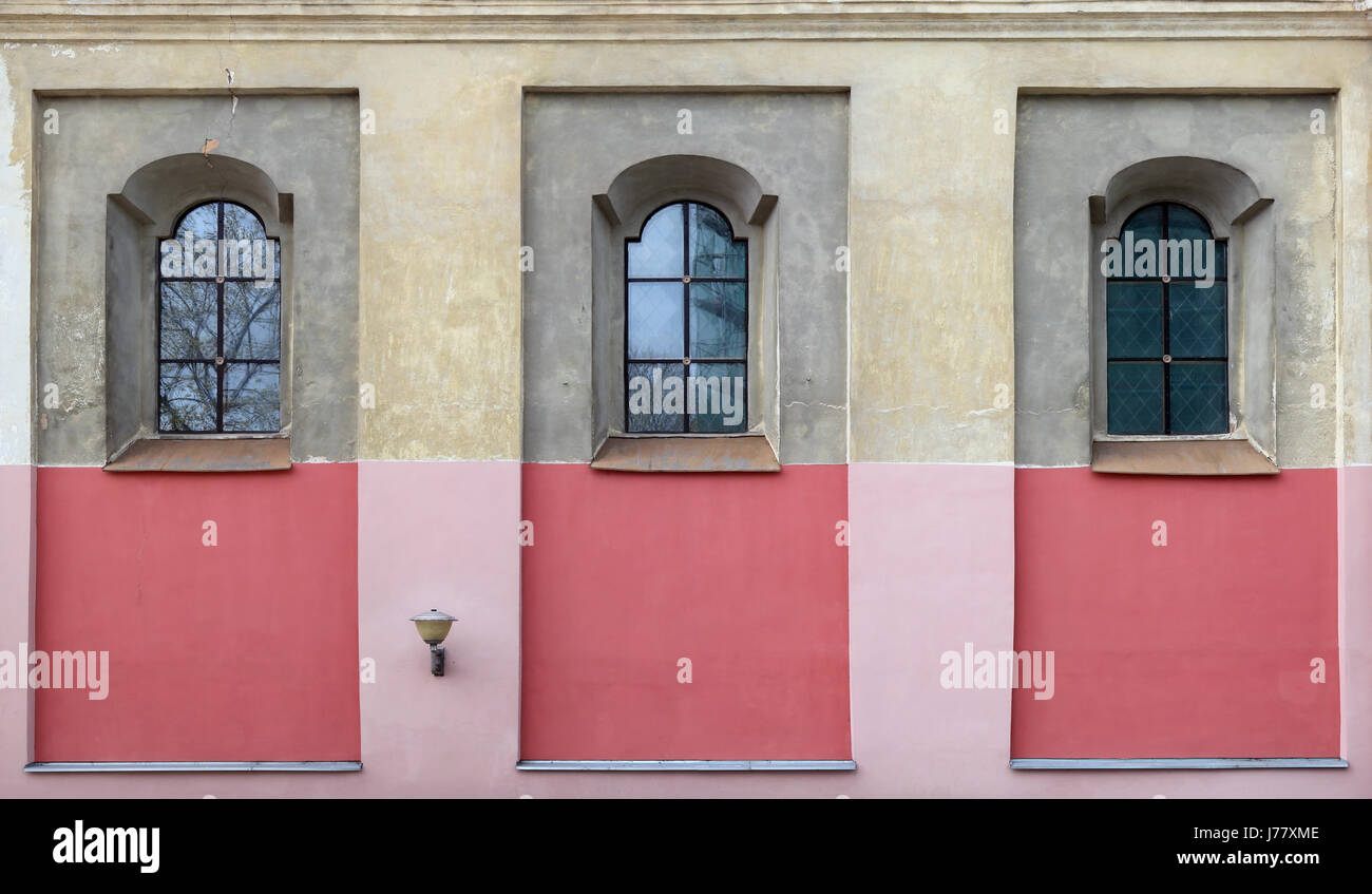 Three windows in half the restored medieval church. The lower half ...