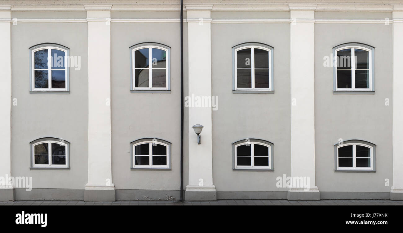 Five white columns, eight plastic windows and one streetlight make a ...