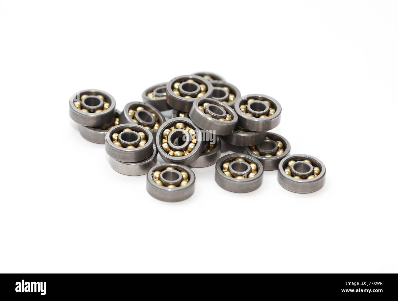 Industrial concept. Set of small ball bearings on white background ...