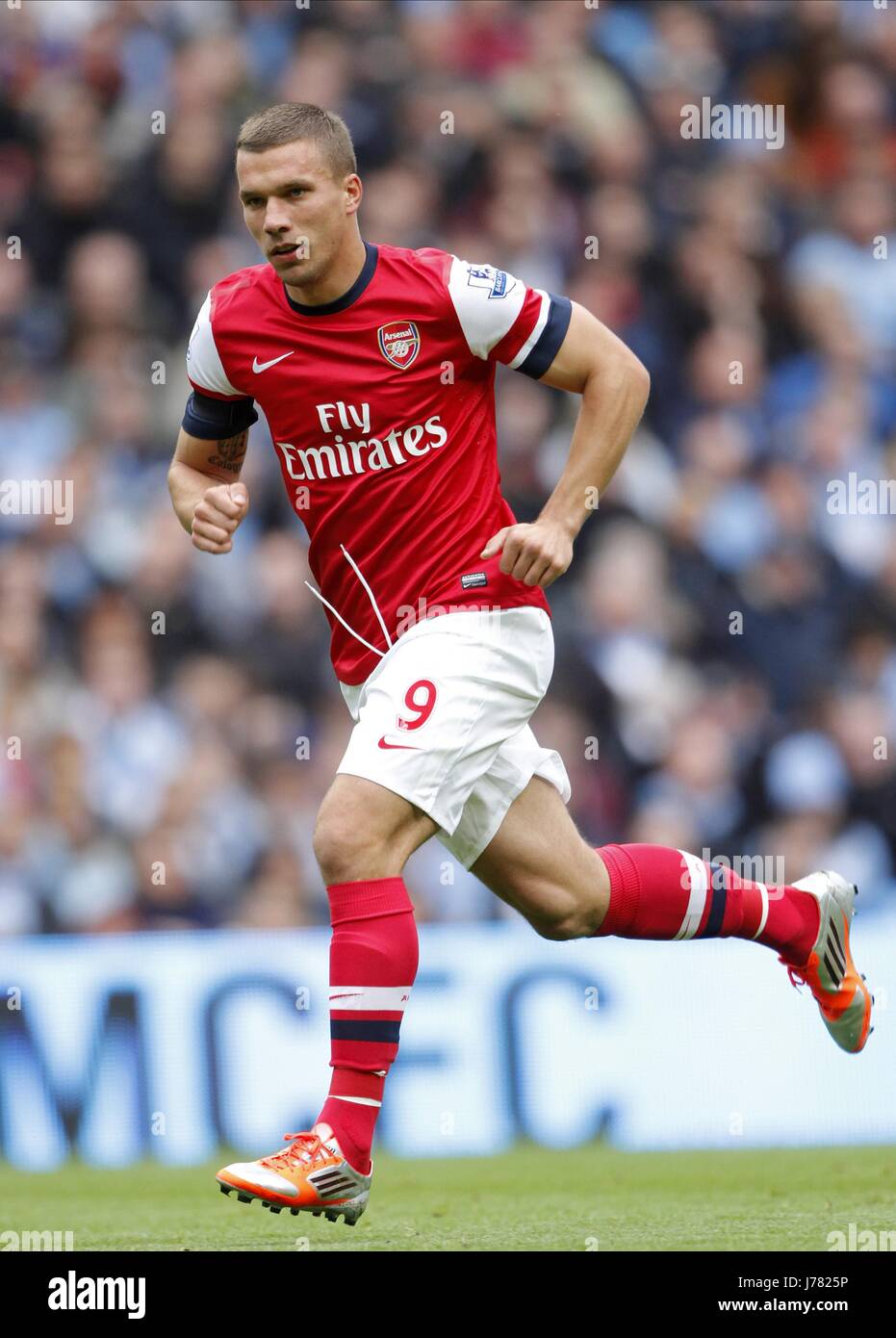 LUKAS PODOLSKI ARSENAL FC ETIHAD STADIUM MANCHESTER ENGLAND 23 ...