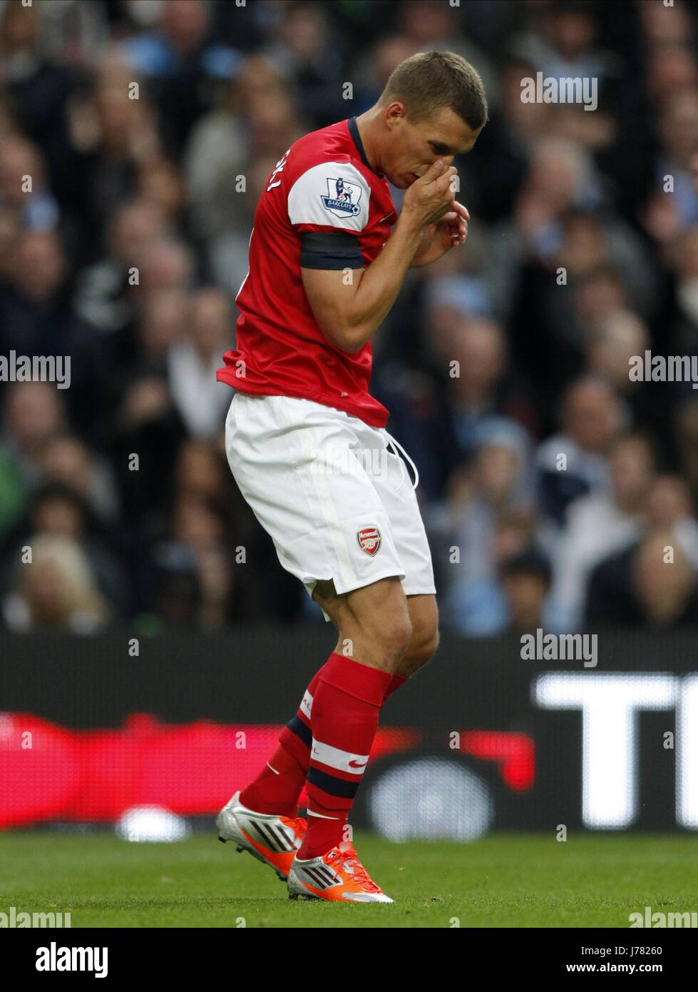LUKAS PODOLSKI ARSENAL FC ETIHAD STADIUM MANCHESTER ENGLAND 23 ...