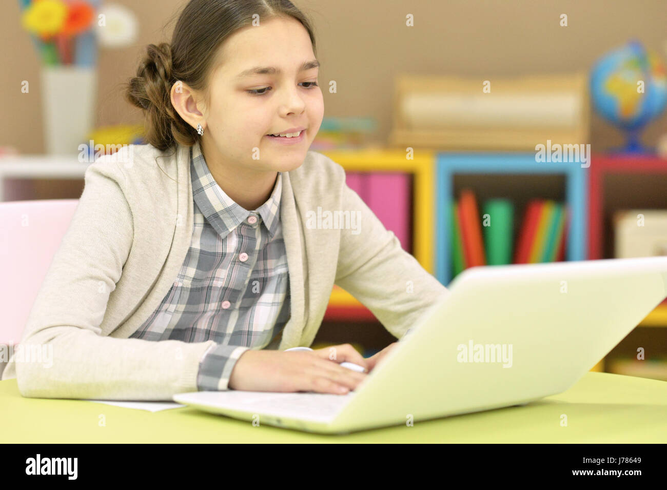 Portrait of a teenage girl using a laptop Stock Photo - Alamy