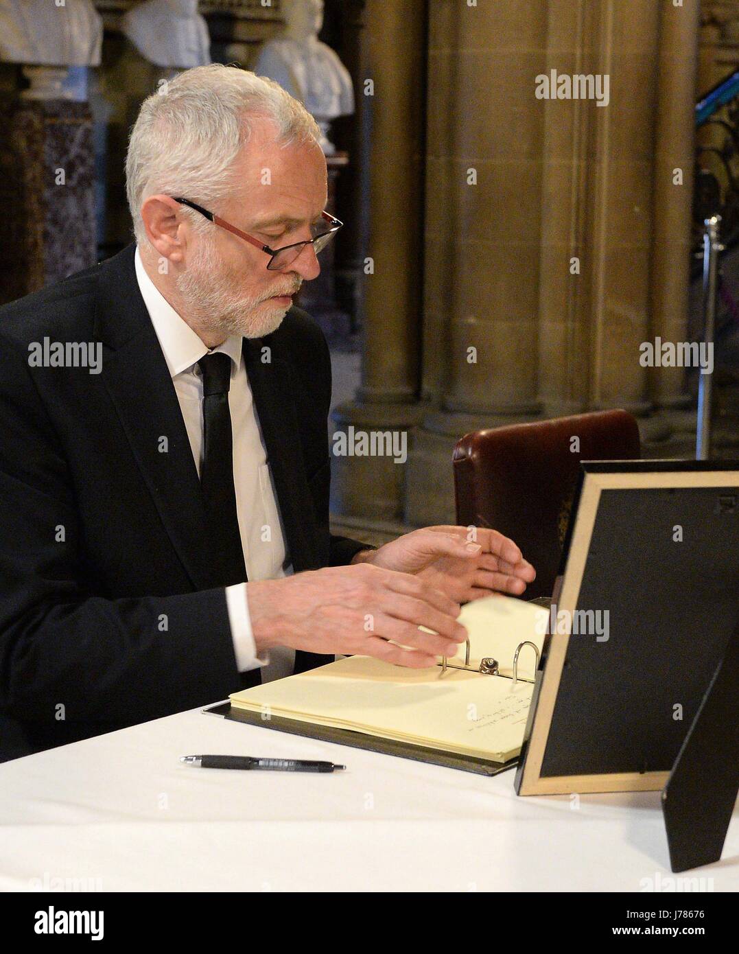 Labour leader Jeremy Corbyn signs a book of condolence at Manchester ...