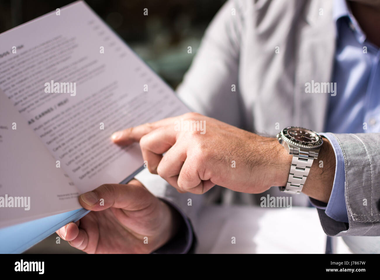 Male Hand Holding Restaurant Menu to Make Order for Lunch Stock Photo ...
