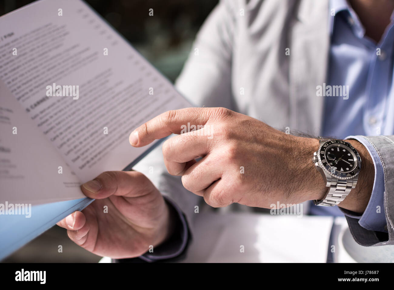 Male Hand Holding Restaurant Menu to Make Order for Lunch Stock Photo ...