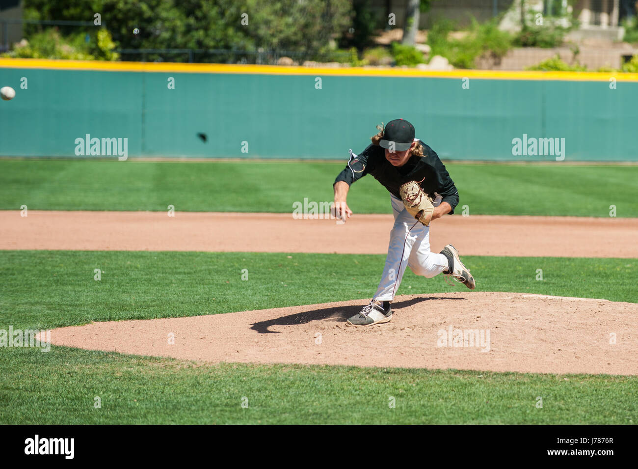 Men's baseball pitcher throwing the curveball with maximum spin Stock ...