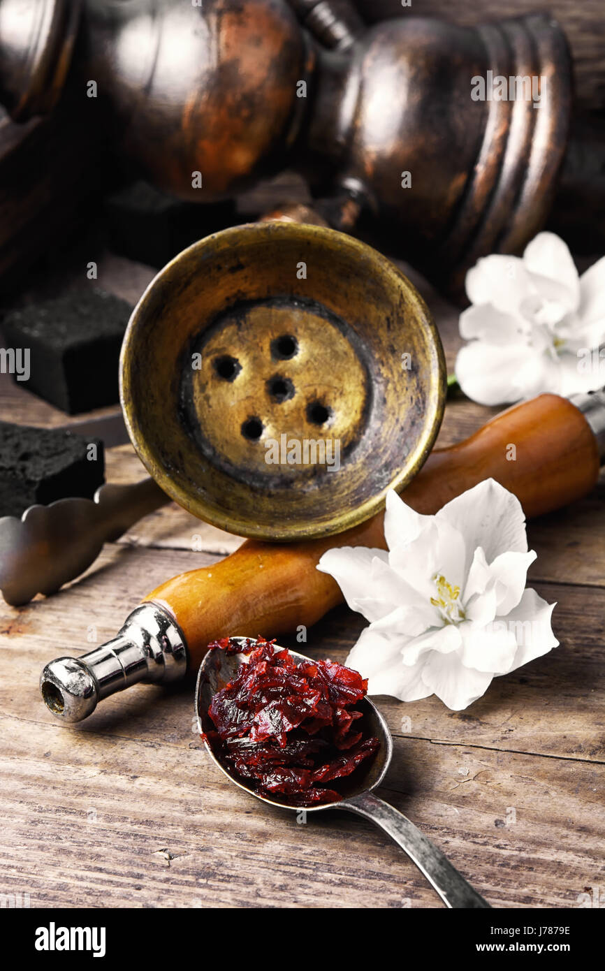 Smoking Turkish Shisha and spoon with Jasmine hookah tobacco Stock ...
