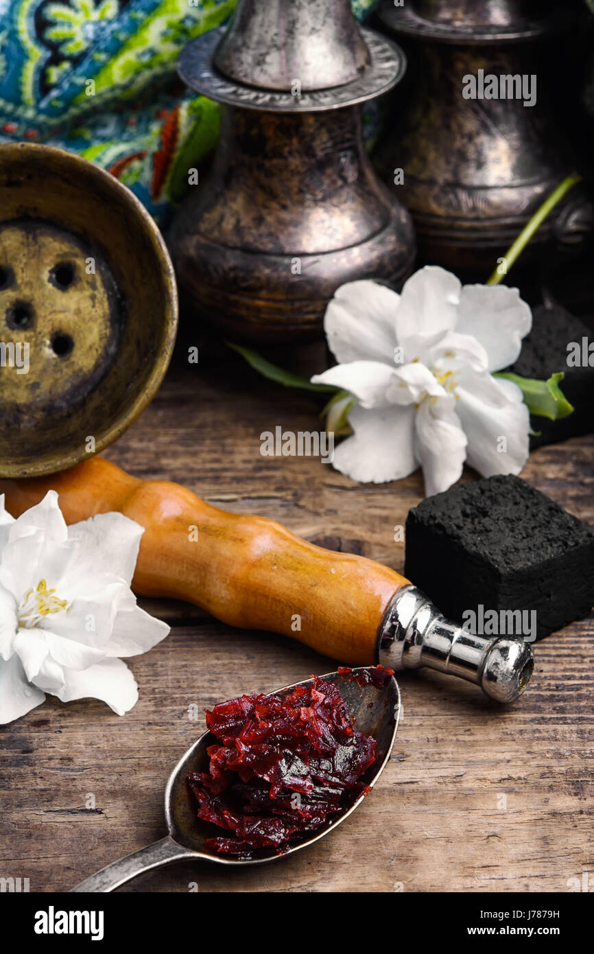 Smoking Turkish Shisha and spoon with Jasmine hookah tobacco Stock ...