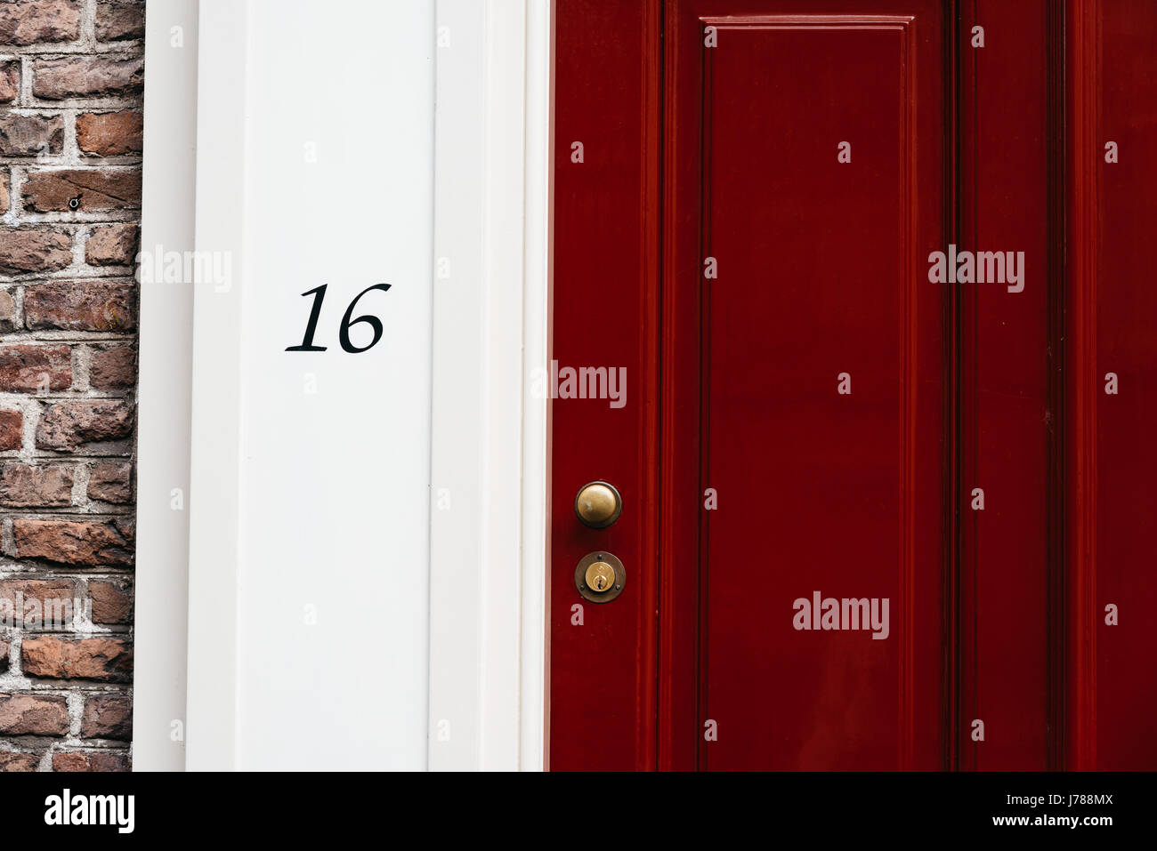 Classic red door with number 16. VIntage style Stock Photo - Alamy