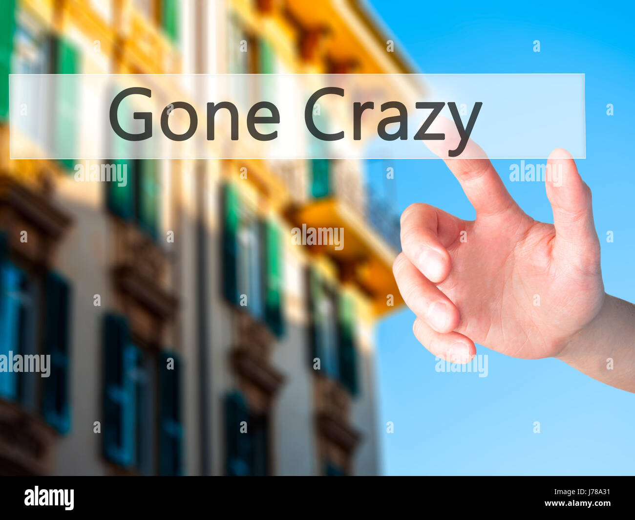 Gone Crazy - Hand pressing a button on blurred background concept ...