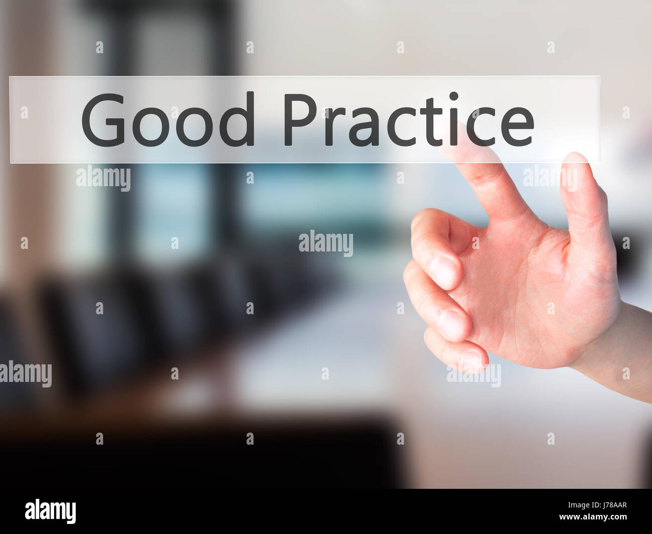 Good Practice - Hand pressing a button on blurred background concept ...