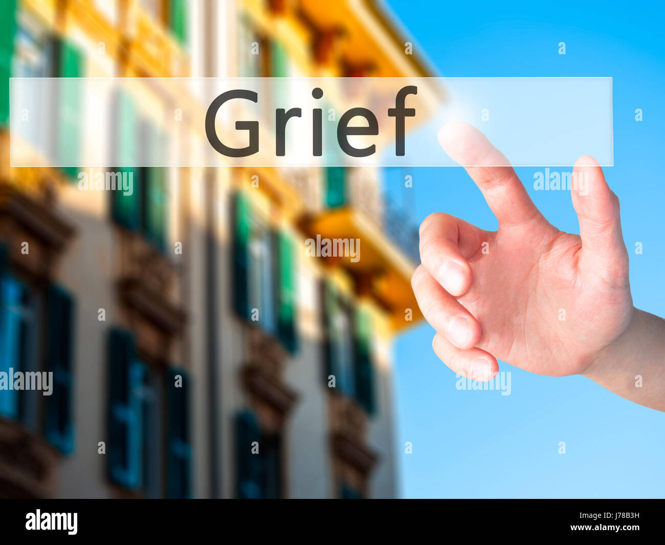 Grief - Hand pressing a button on blurred background concept . Business ...