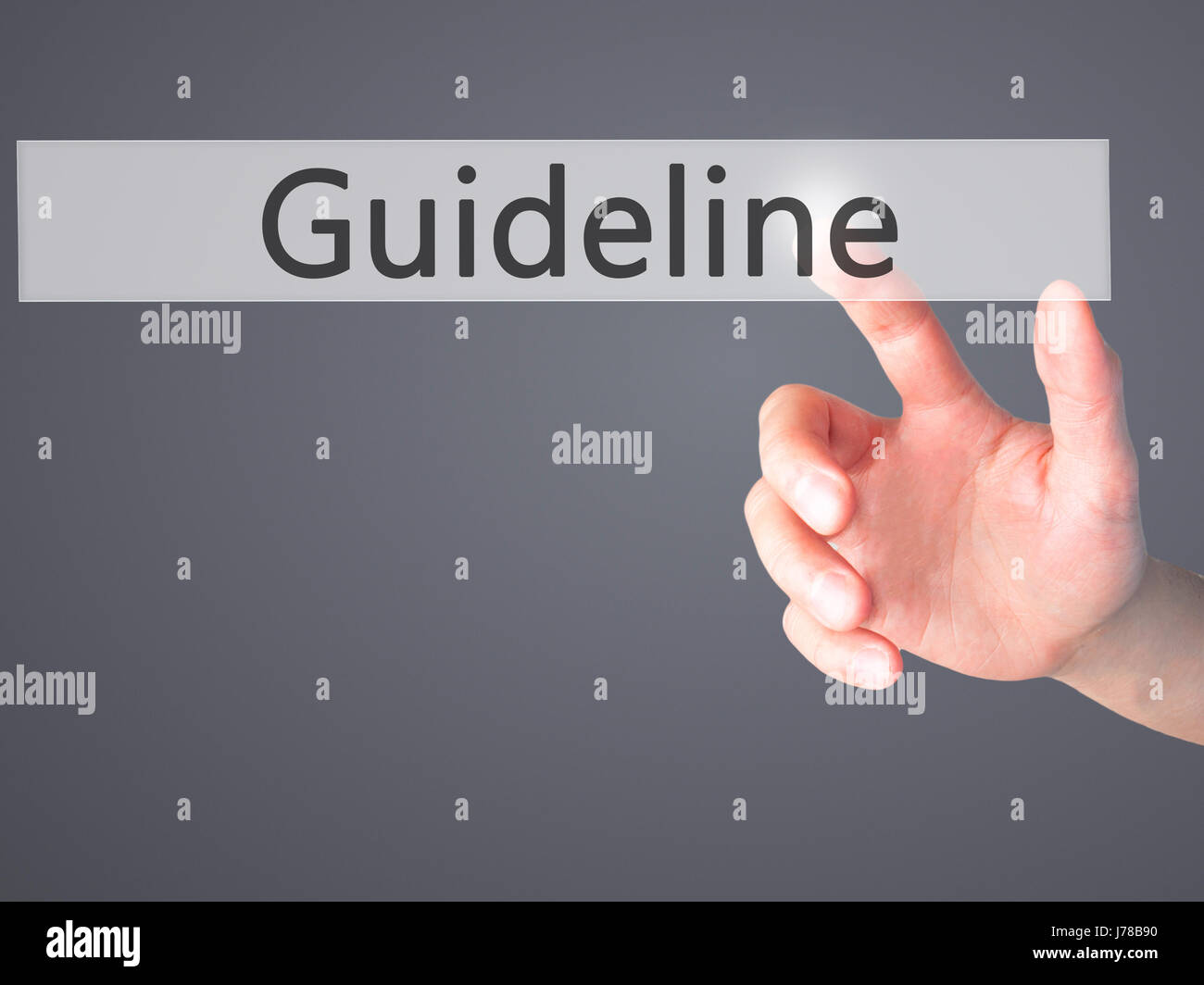 Guideline - Hand pressing a button on blurred background concept ...