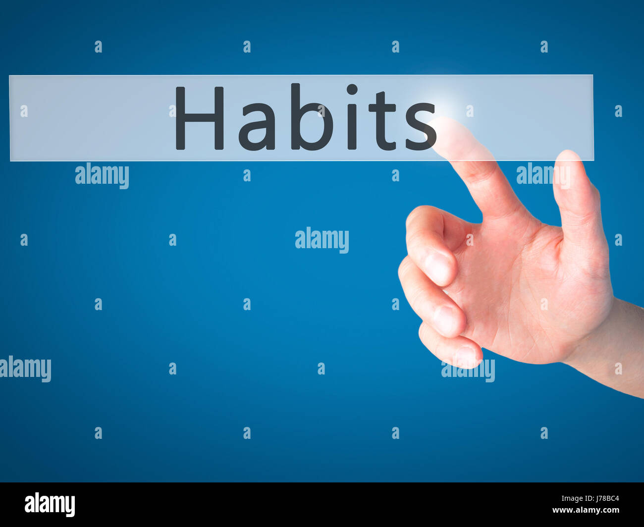Habits - Hand pressing a button on blurred background concept ...