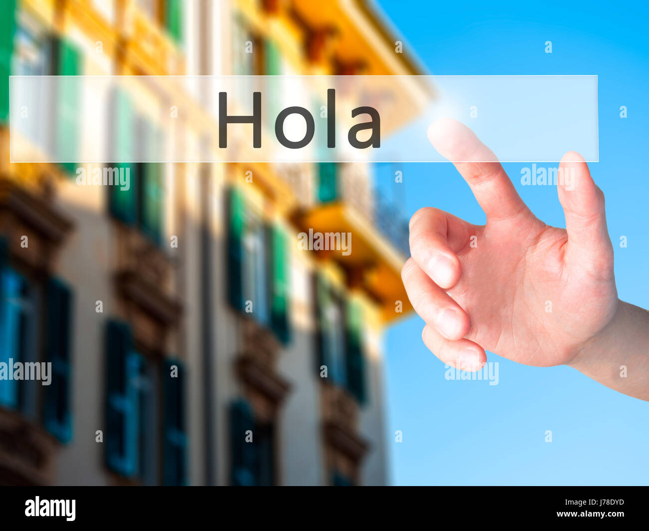 Hola - Hand pressing a button on blurred background concept . Business ...