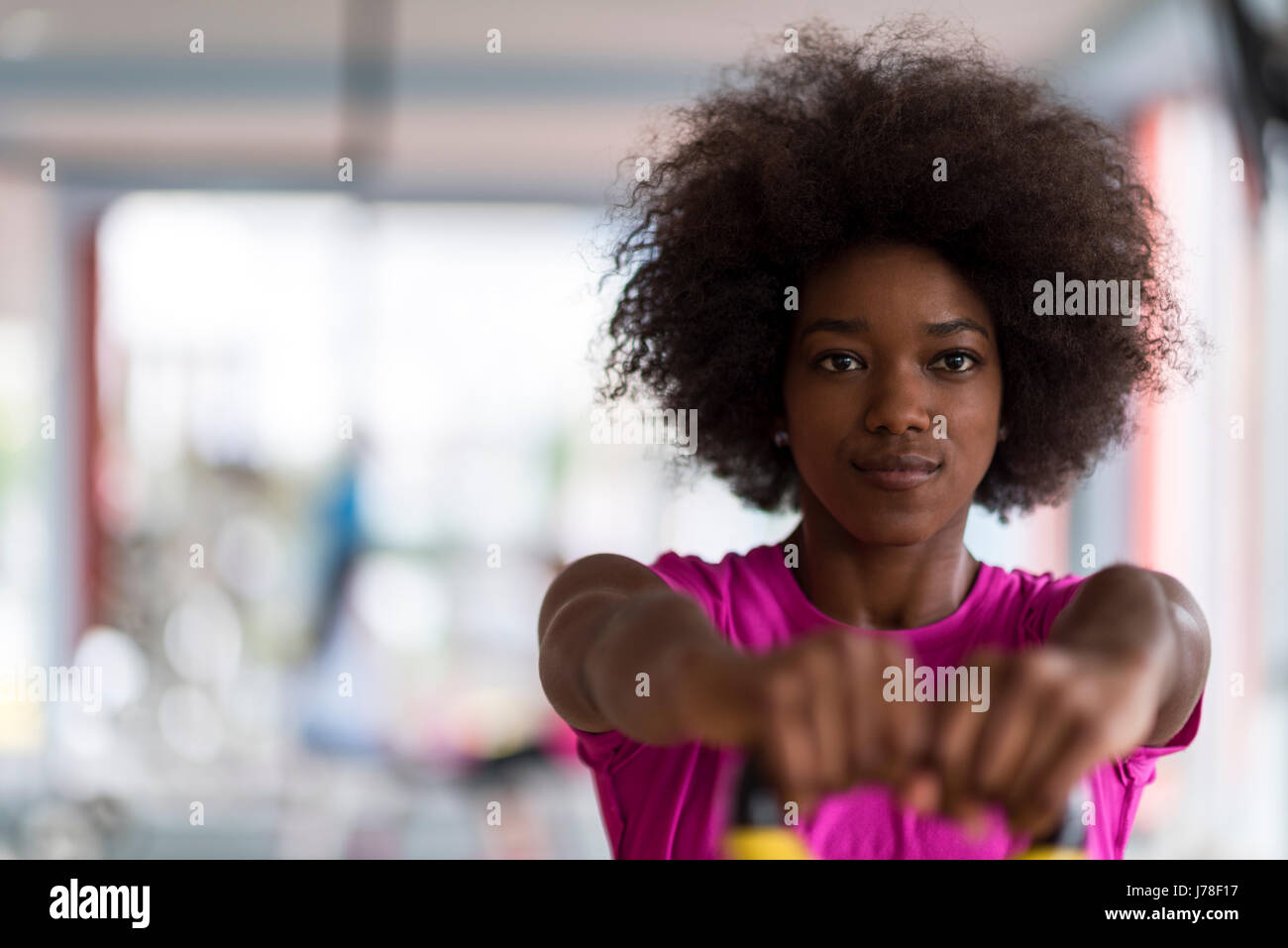 happy healthy african american woman working out in a crossfit gym on ...