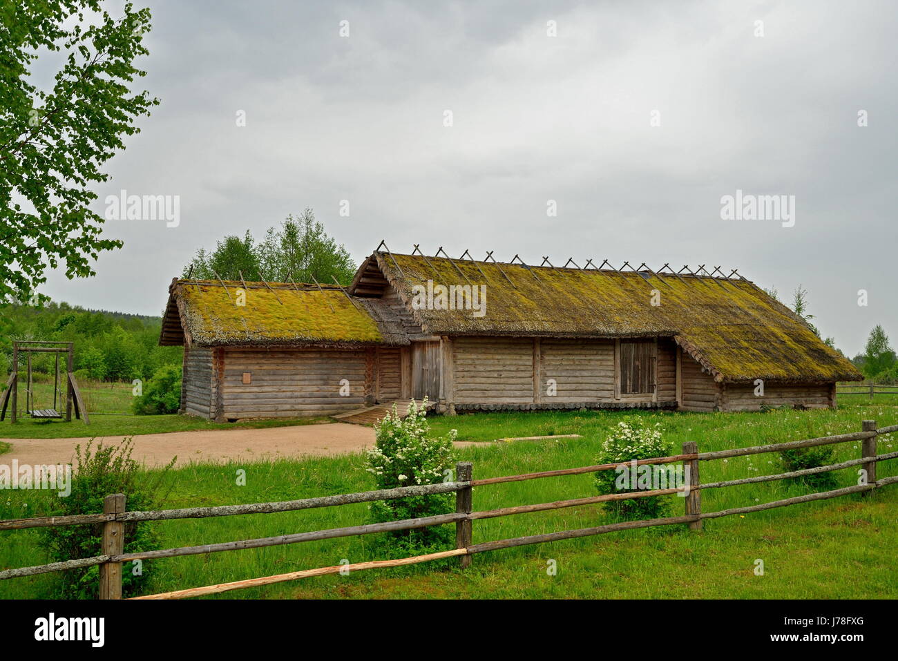 Old wooden log barn in the Museum of Pushkin Mikhailovskoe village ...
