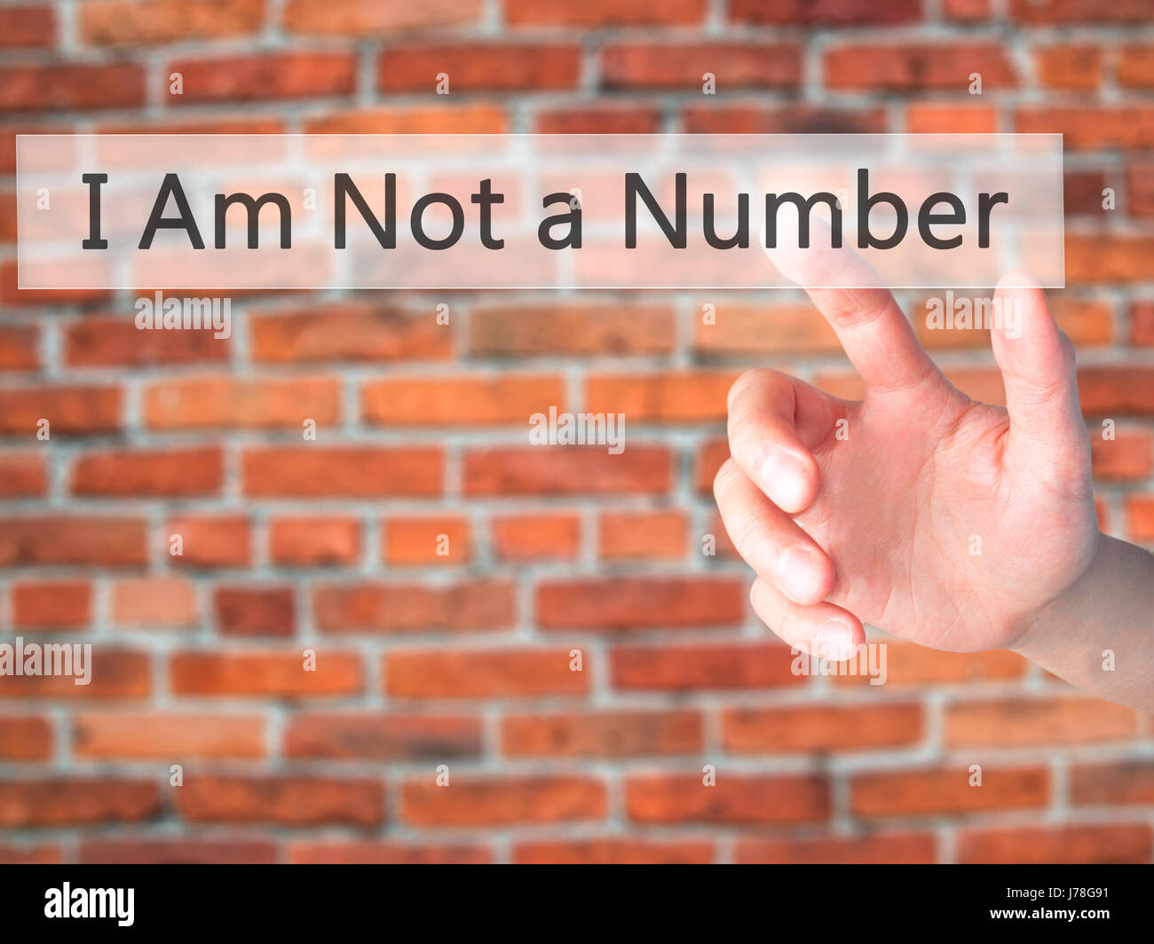 I Am Not a Number - Hand pressing a button on blurred background ...