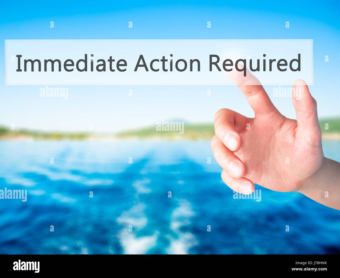 Immediate Action Required - Hand pressing a button on blurred ...