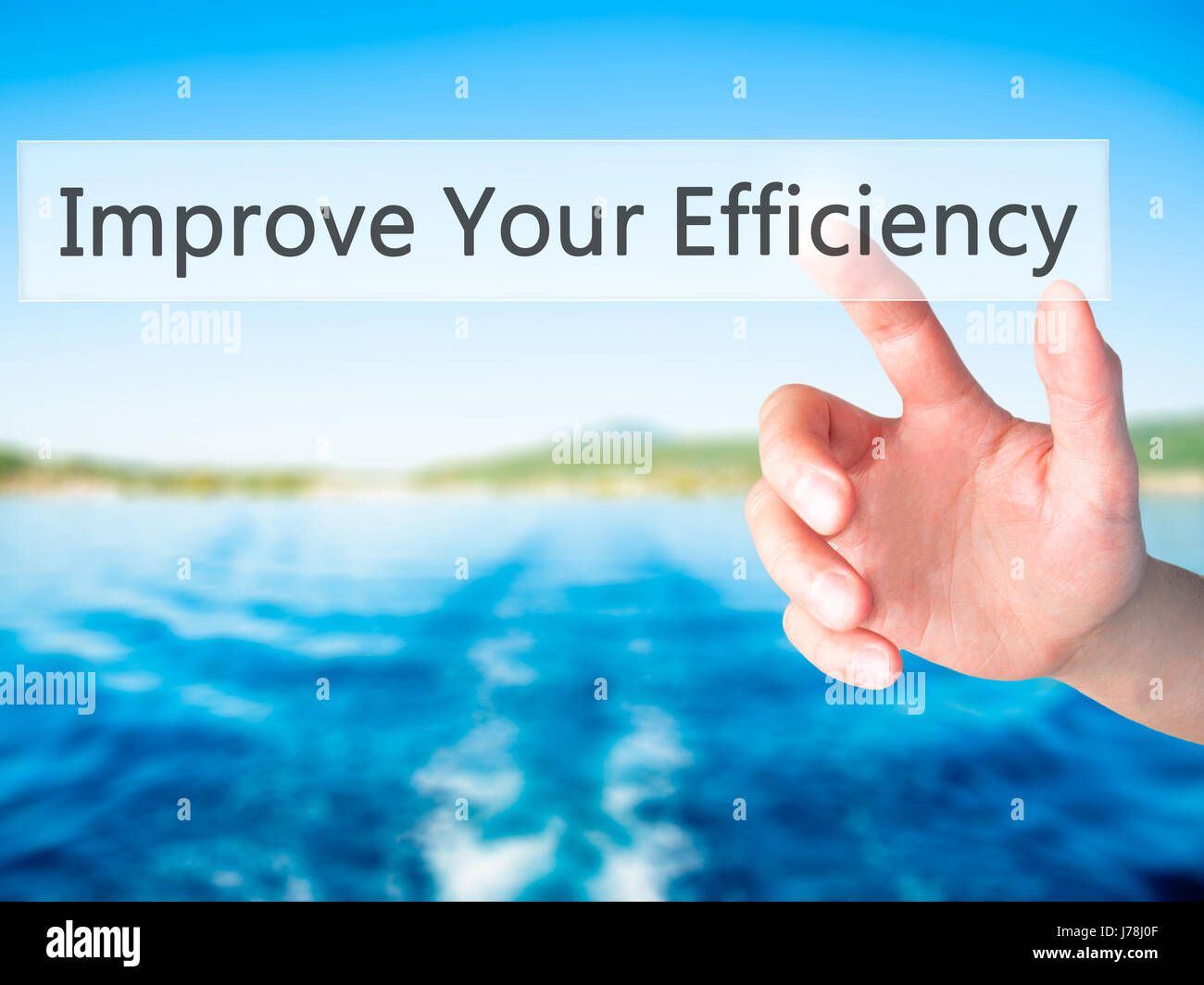 Improve Your Efficiency - Hand pressing a button on blurred background ...