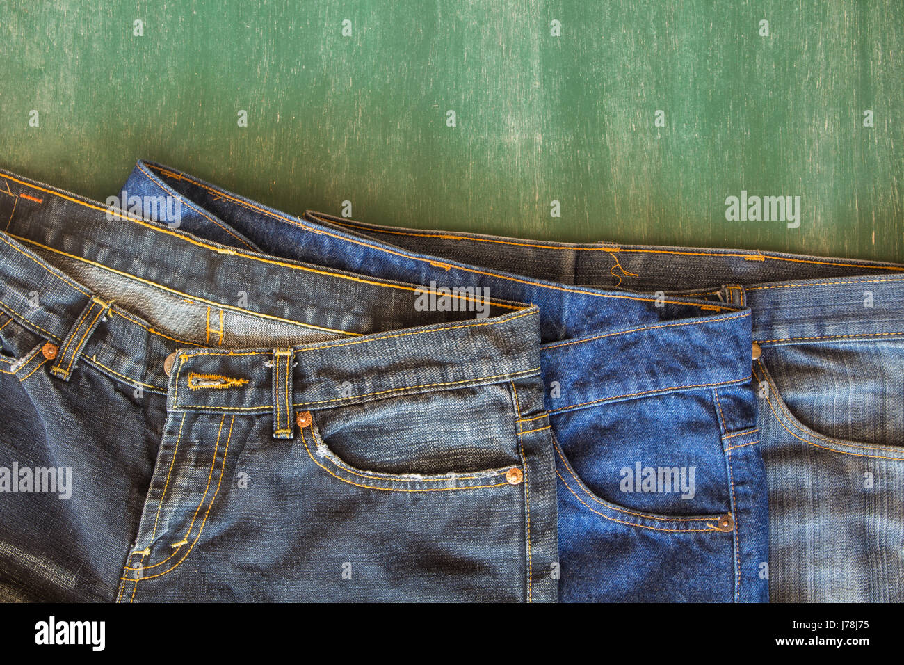 three pattern of jeans with chalkboard background Stock Photo - Alamy